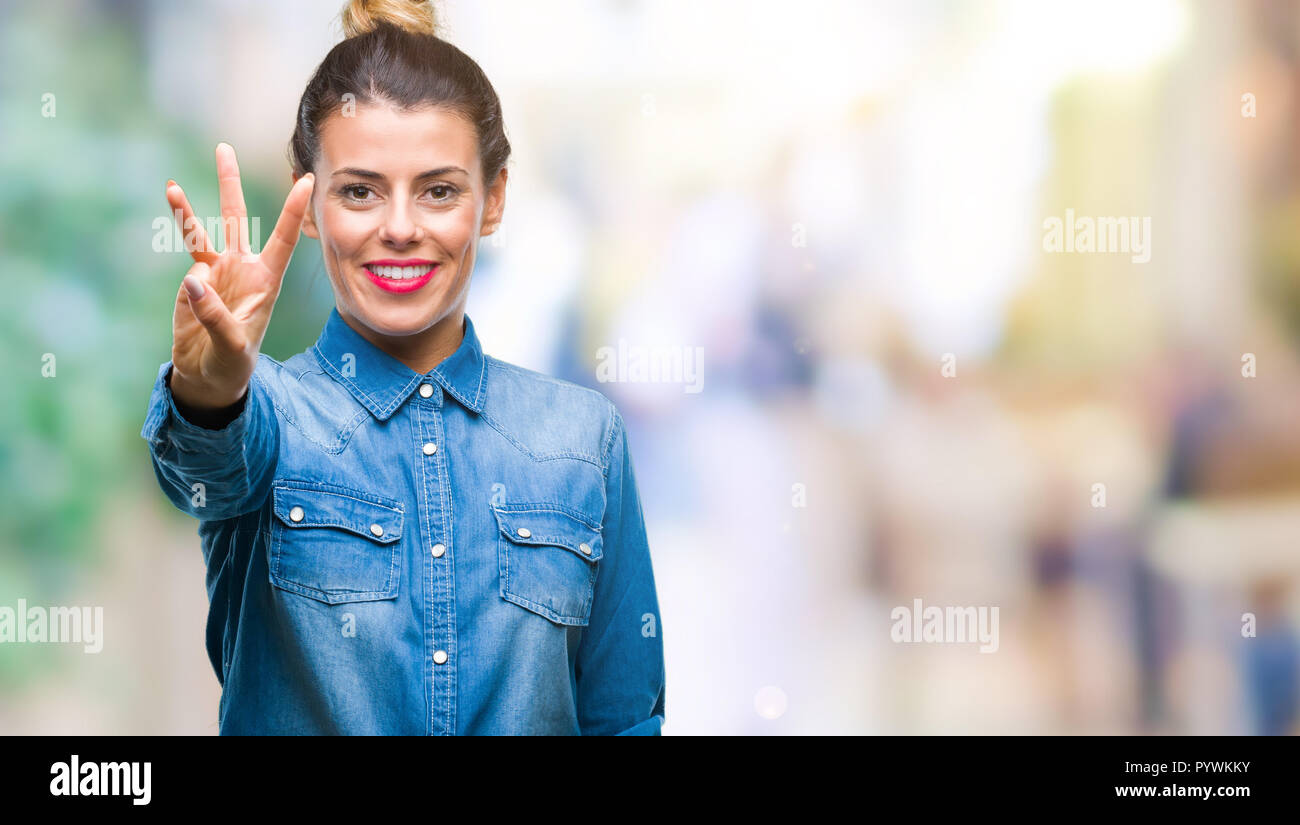 Young beautiful woman over isolated background showing and pointing up ...