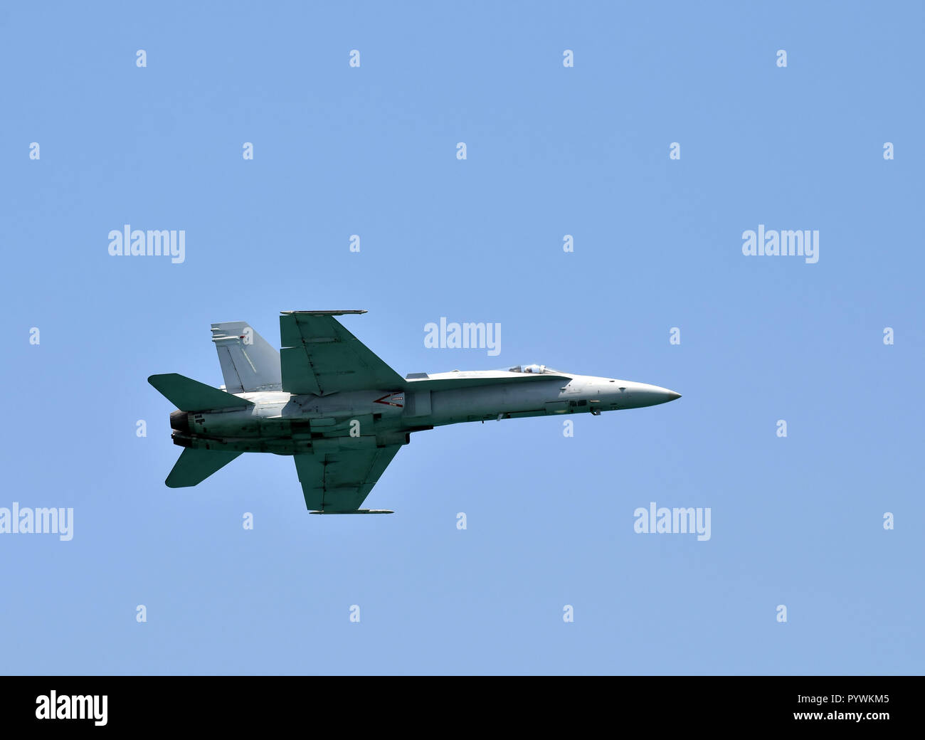 Modern navy fighter jet against blue sky side view Stock Photo - Alamy