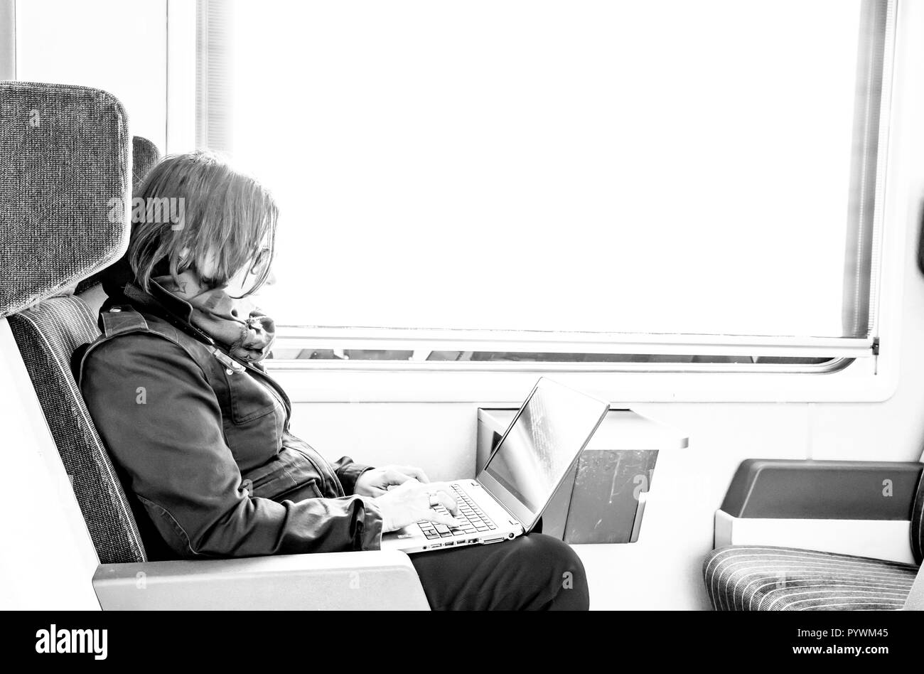 Woman train window Black and White Stock Photos & Images - Alamy