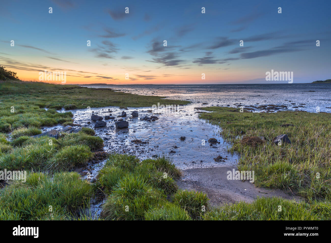 Tidal marsh Sea Inlet sunset at low tide near Waren mill ...