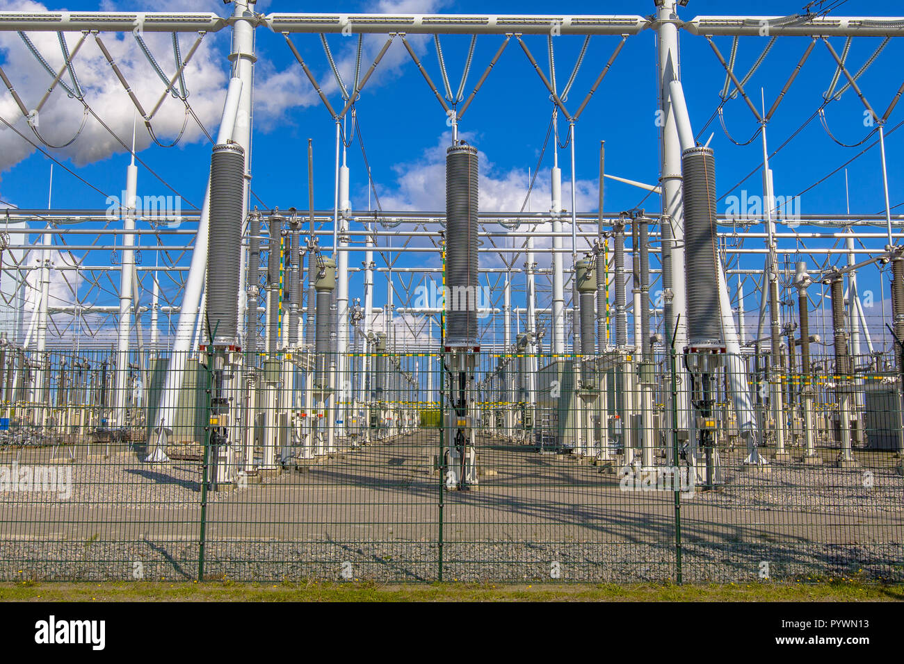 Modern high-voltage Power substation with switch on blue sky background ...