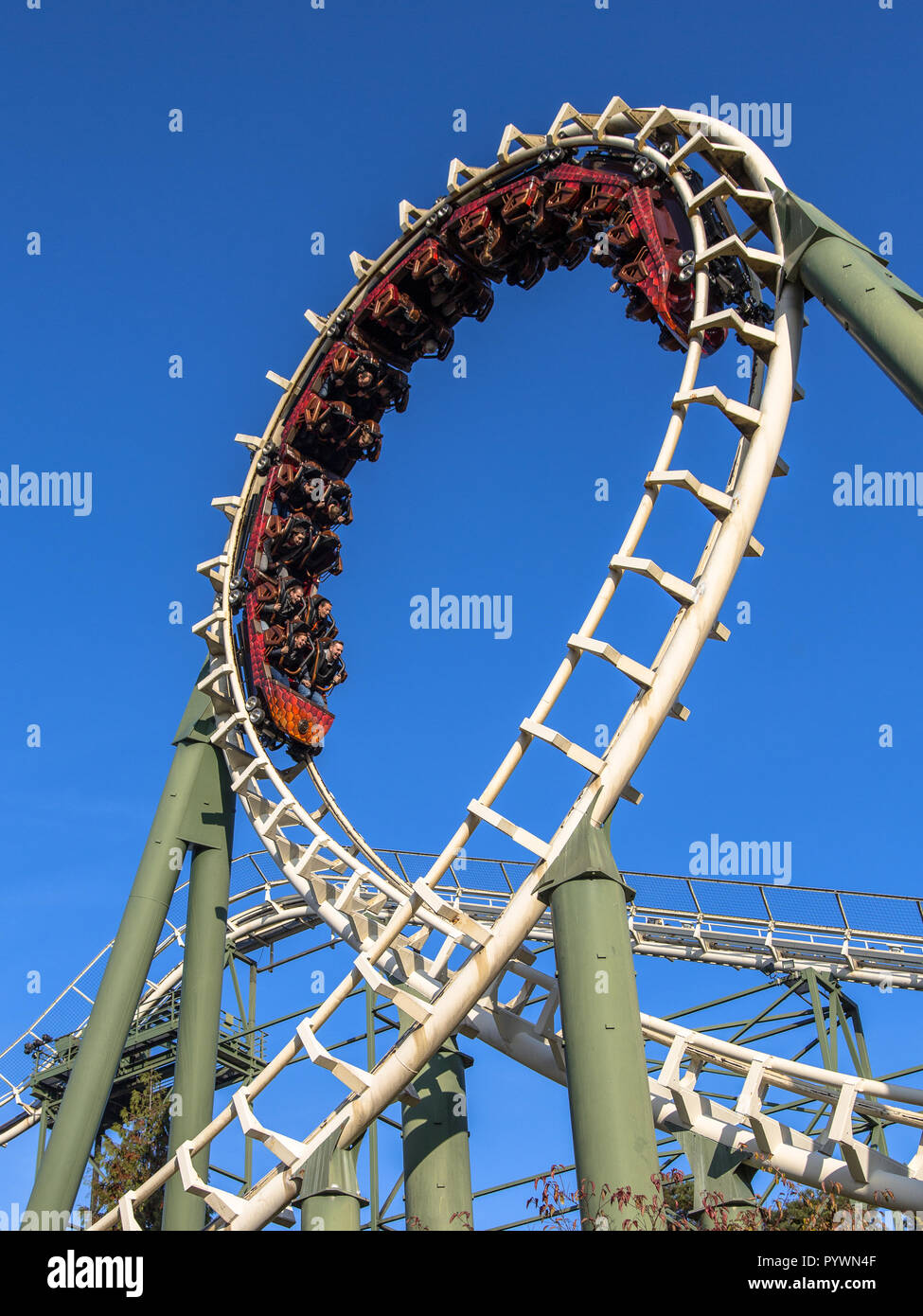 People enjoying an exhilerating rollercoaster ride at a theme park ...