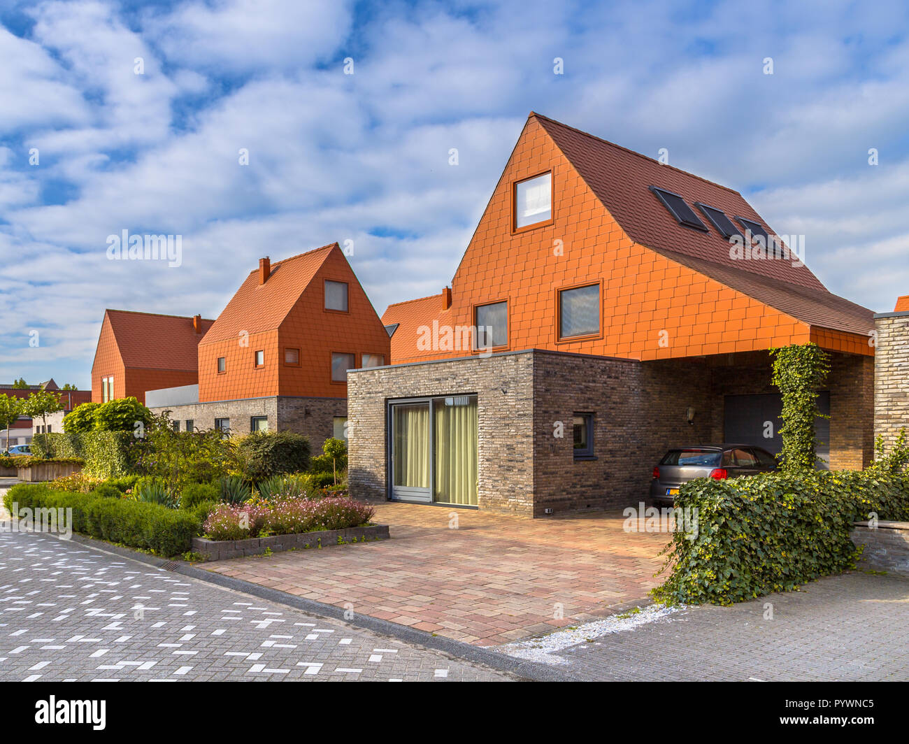Modern architecture houses with remarkable red roof tiles in a ...