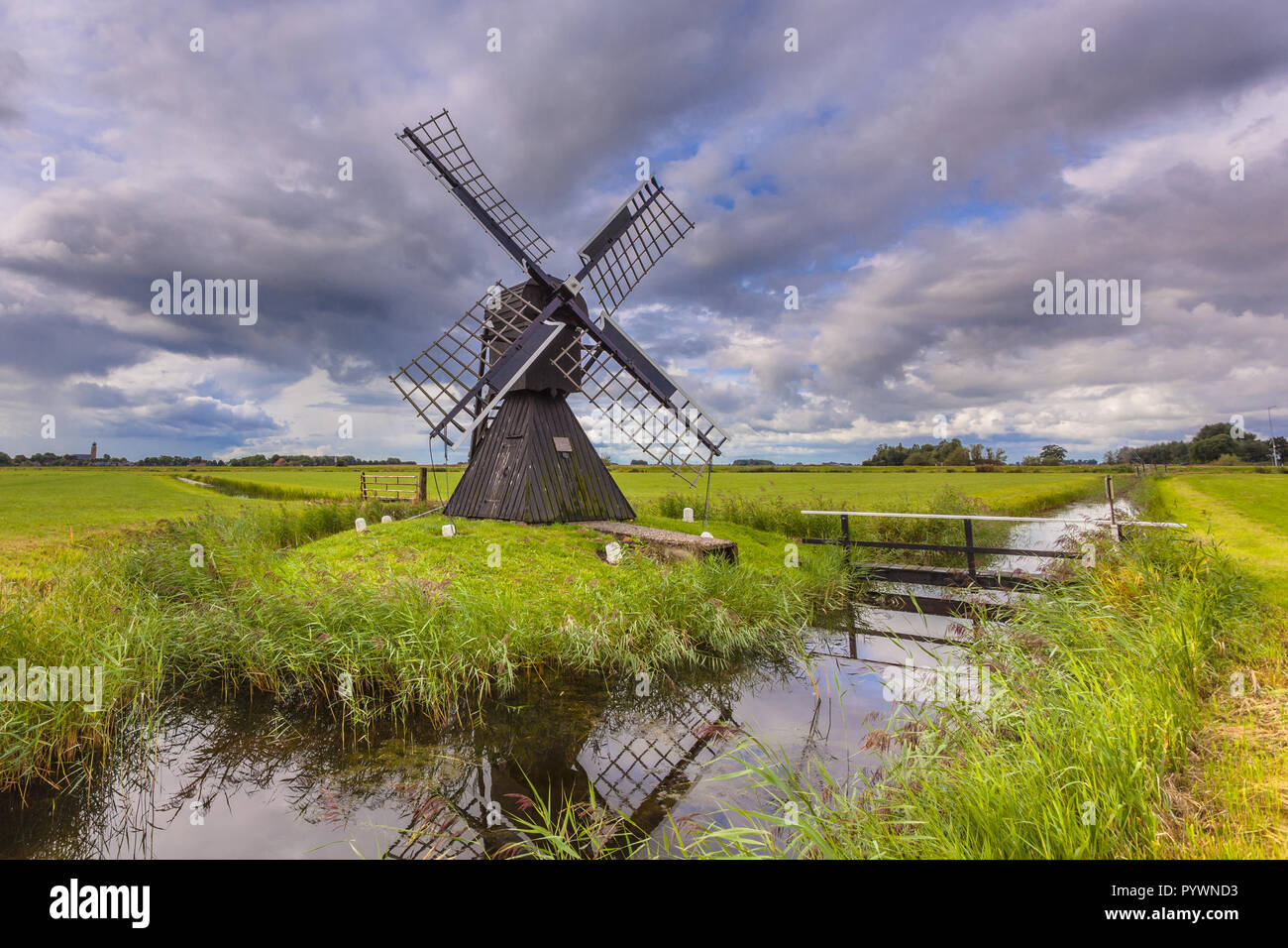 Black Wooden Windmill. Historic water management pump device to drain ...