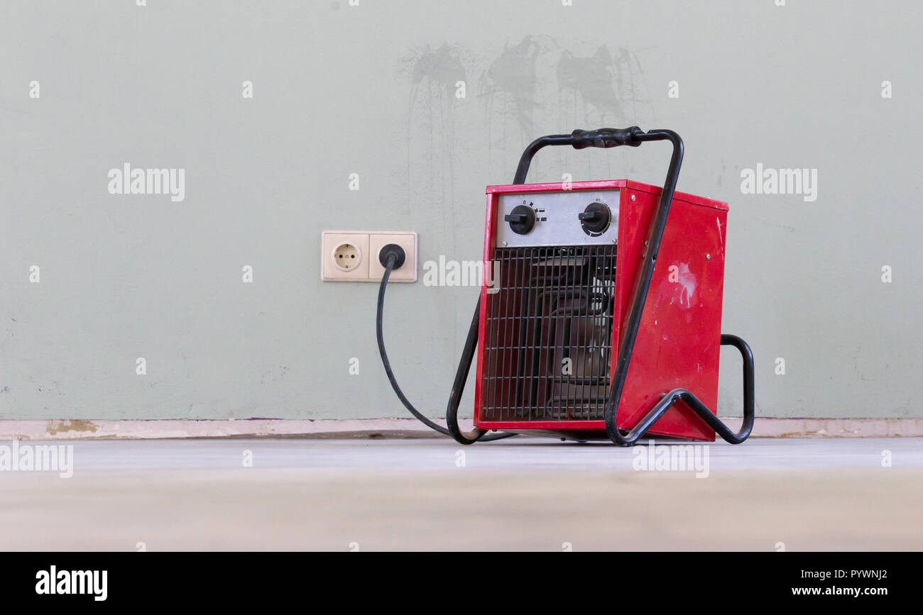 Compact red heater, drying the floor before installing the PVC floor ...