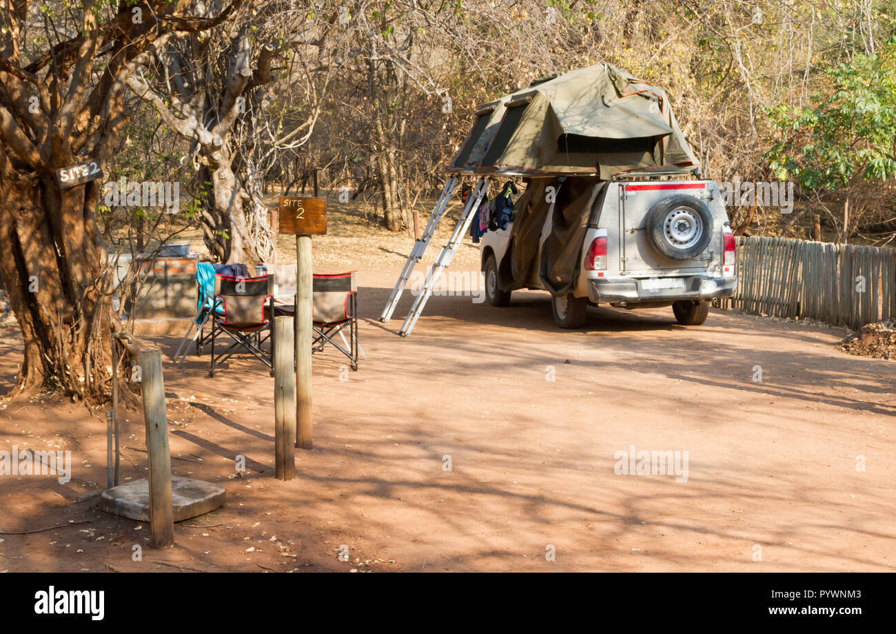 Offroad 4x4 vehicle with tent in the roof ready for camping in the ...