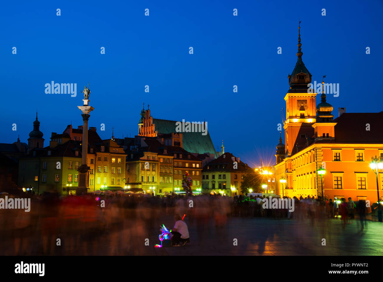 Nightlife in Warsaw, Poland, people at the palace square. Illuminated ...
