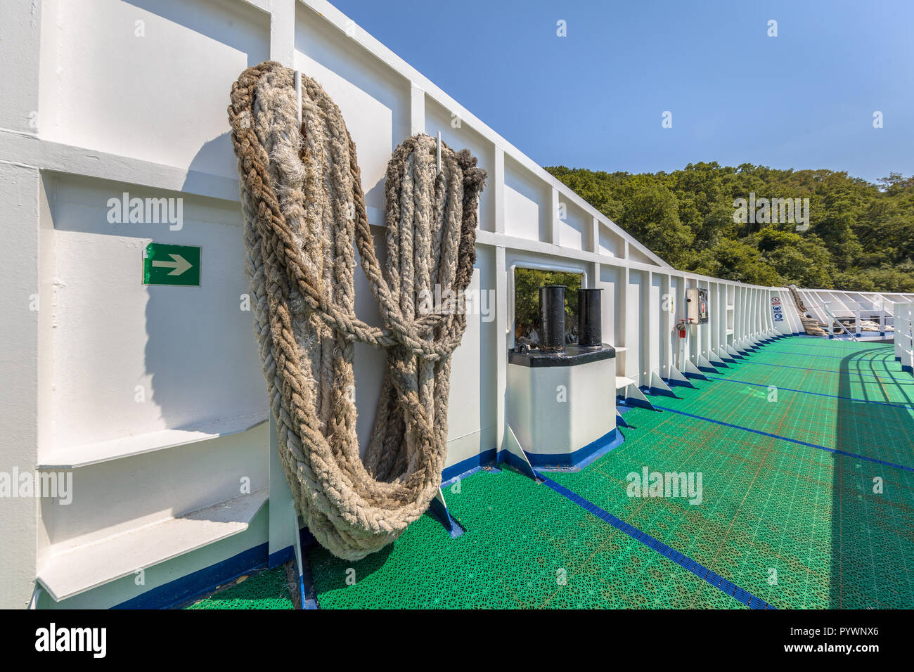 Close-up of a mooring rope with cleat. Nautical mooring rope on bow of ...