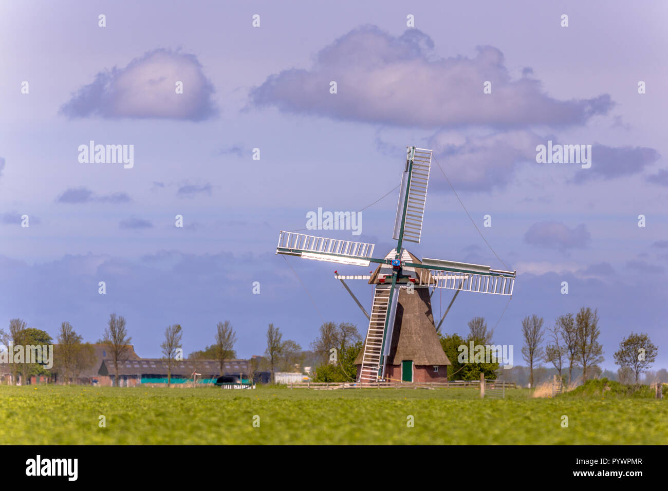 Traditional windmill under beautiful sky in Groningen landscape near ...
