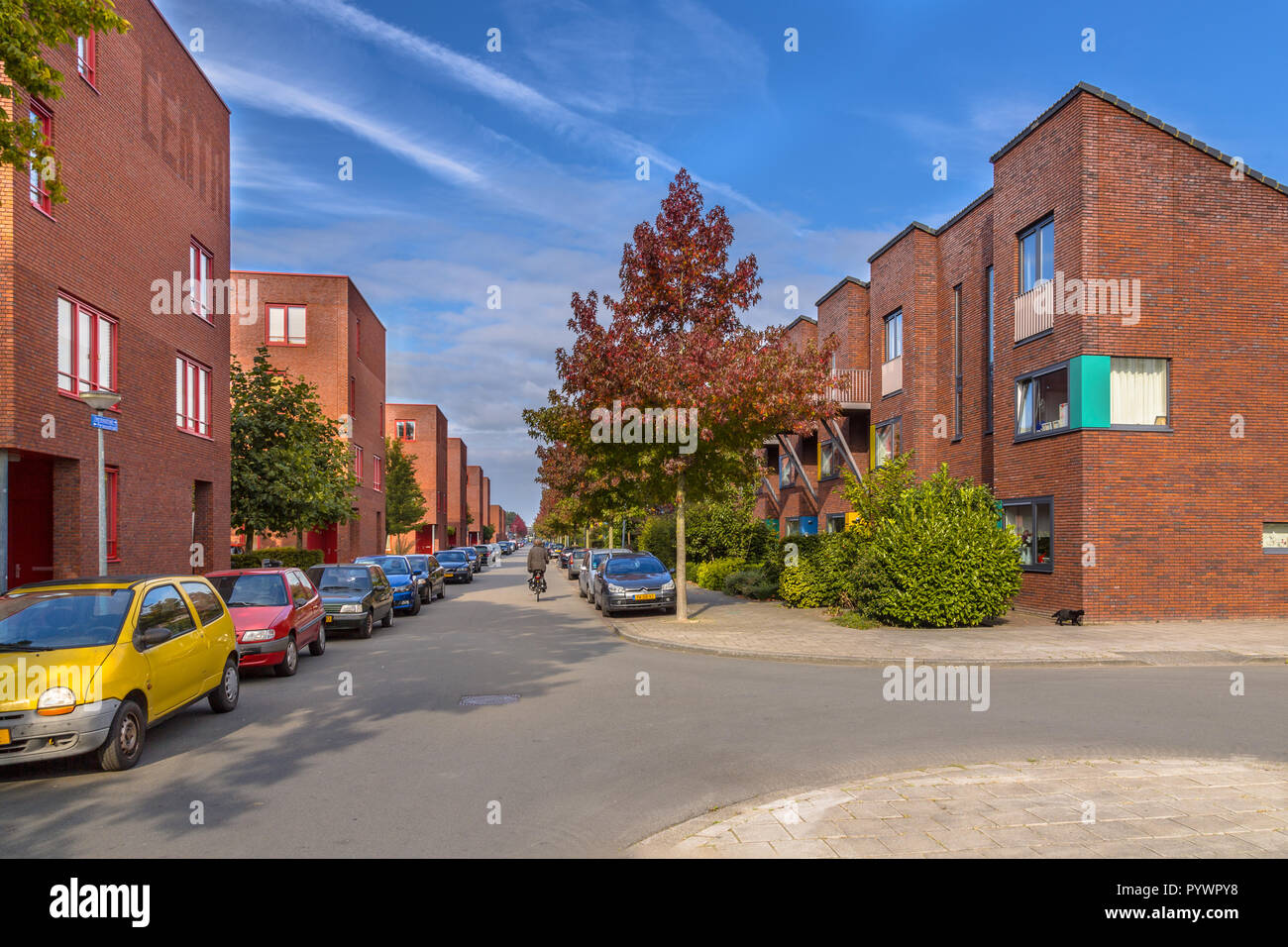Street with modern suburban family row houses in a suburban ...