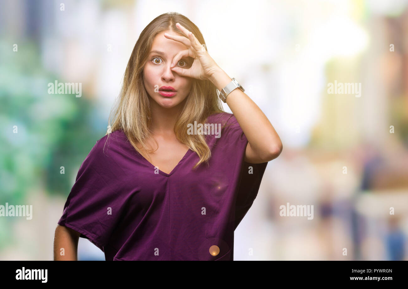 Young beautiful blonde elegant woman over isolated background doing ok ...