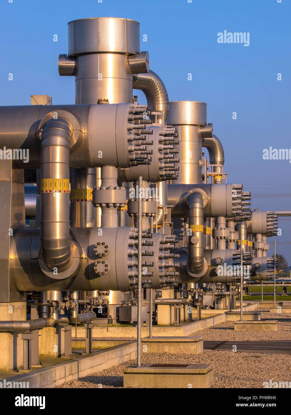 Close detail of pipe flanges and valves from a chemical industry plant ...