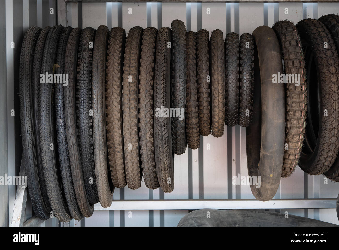 lot of moto, bike, motobike tyres different sizes and types hangs at ...