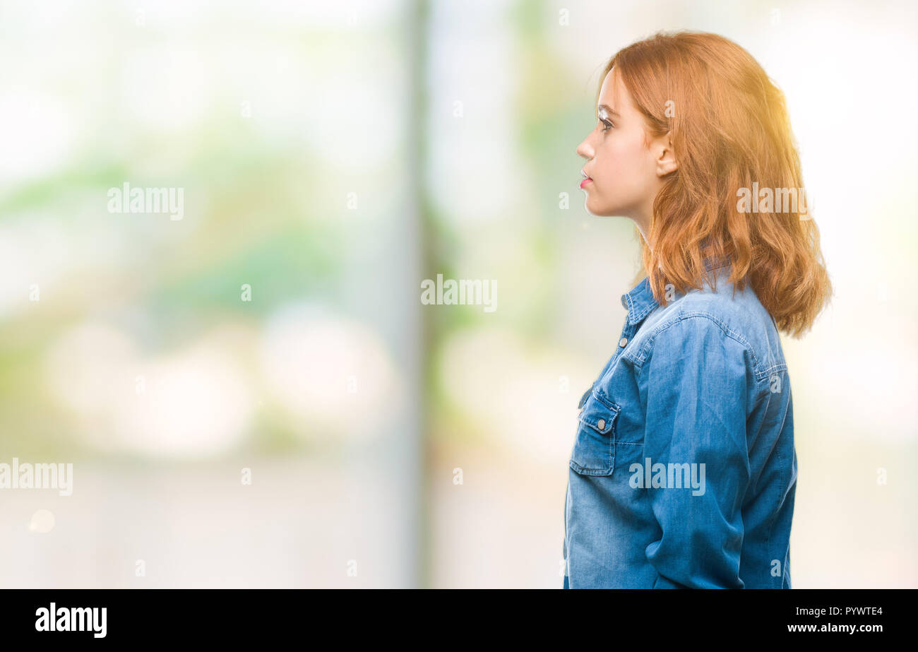 Young beautiful woman over isolated background looking to side, relax ...
