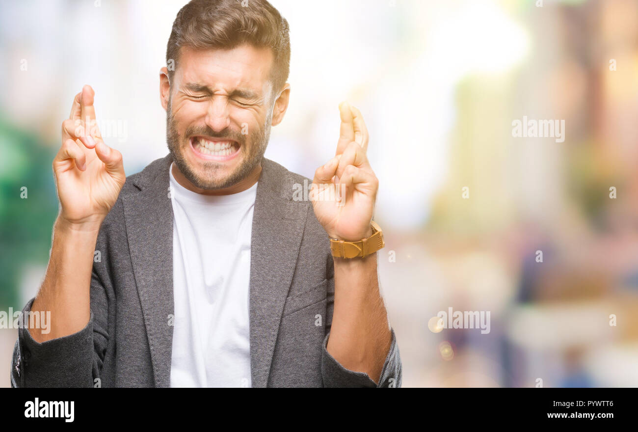 Young handsome business man over isolated background smiling crossing ...