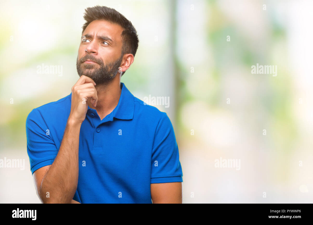 Adult hispanic man over isolated background with hand on chin thinking ...