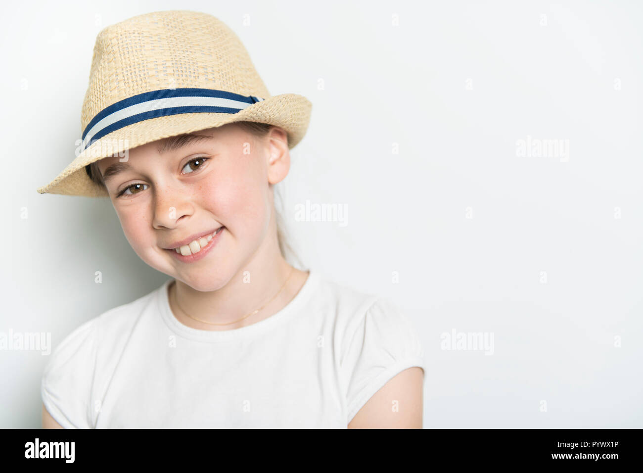 A Portrait of cute, confident 9 years old girl, isolated on white with ...