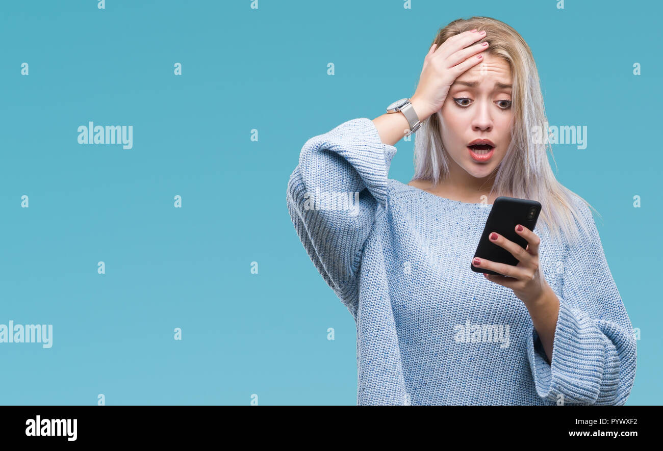 Young blonde woman texting sending message using smartphone over ...