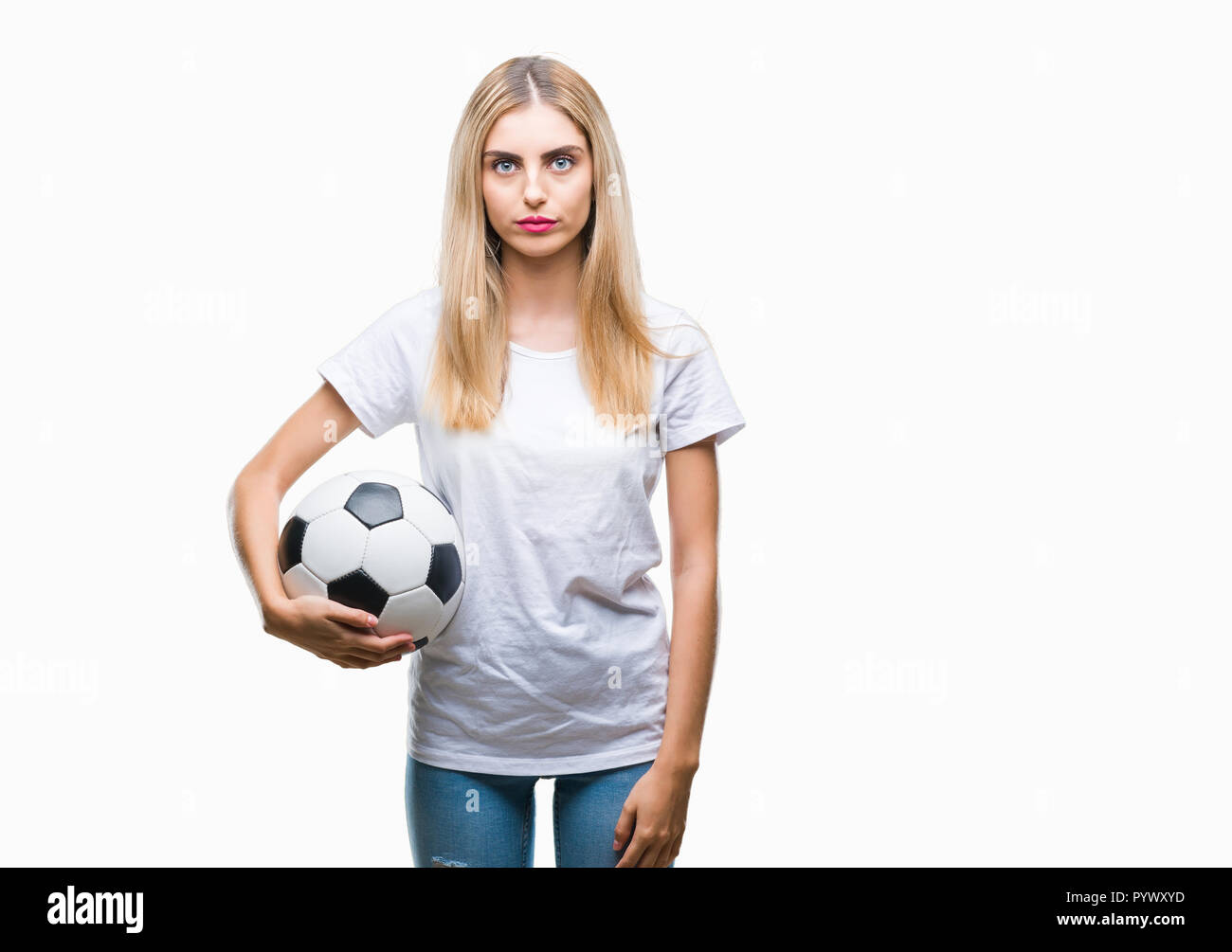 Young beautiful blonde woman holding soccer ball over isolated ...