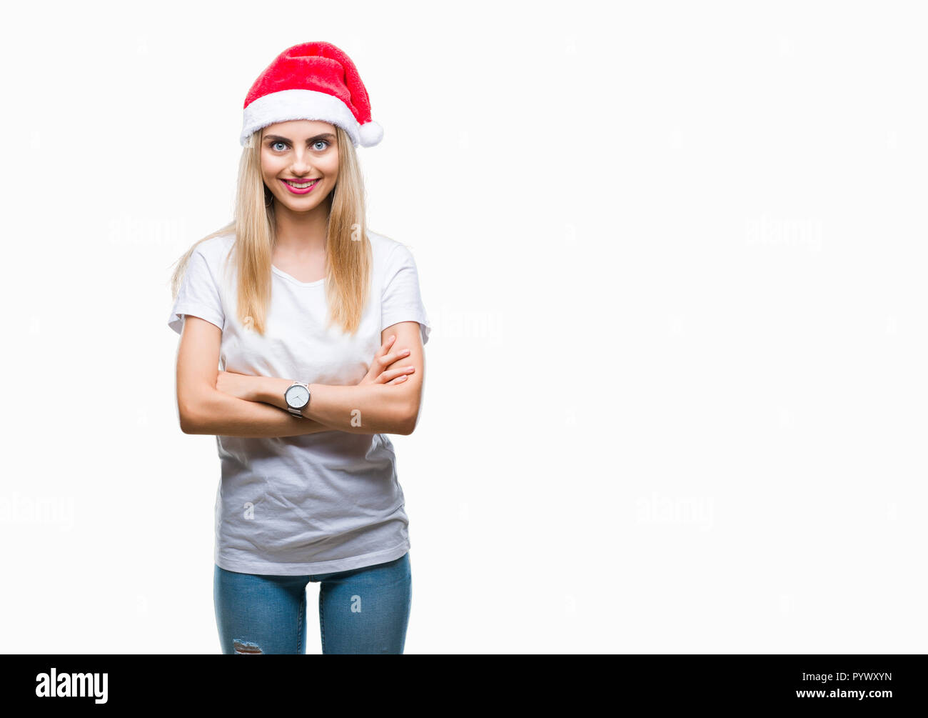 Young beautiful blonde woman christmas hat over isolated background ...