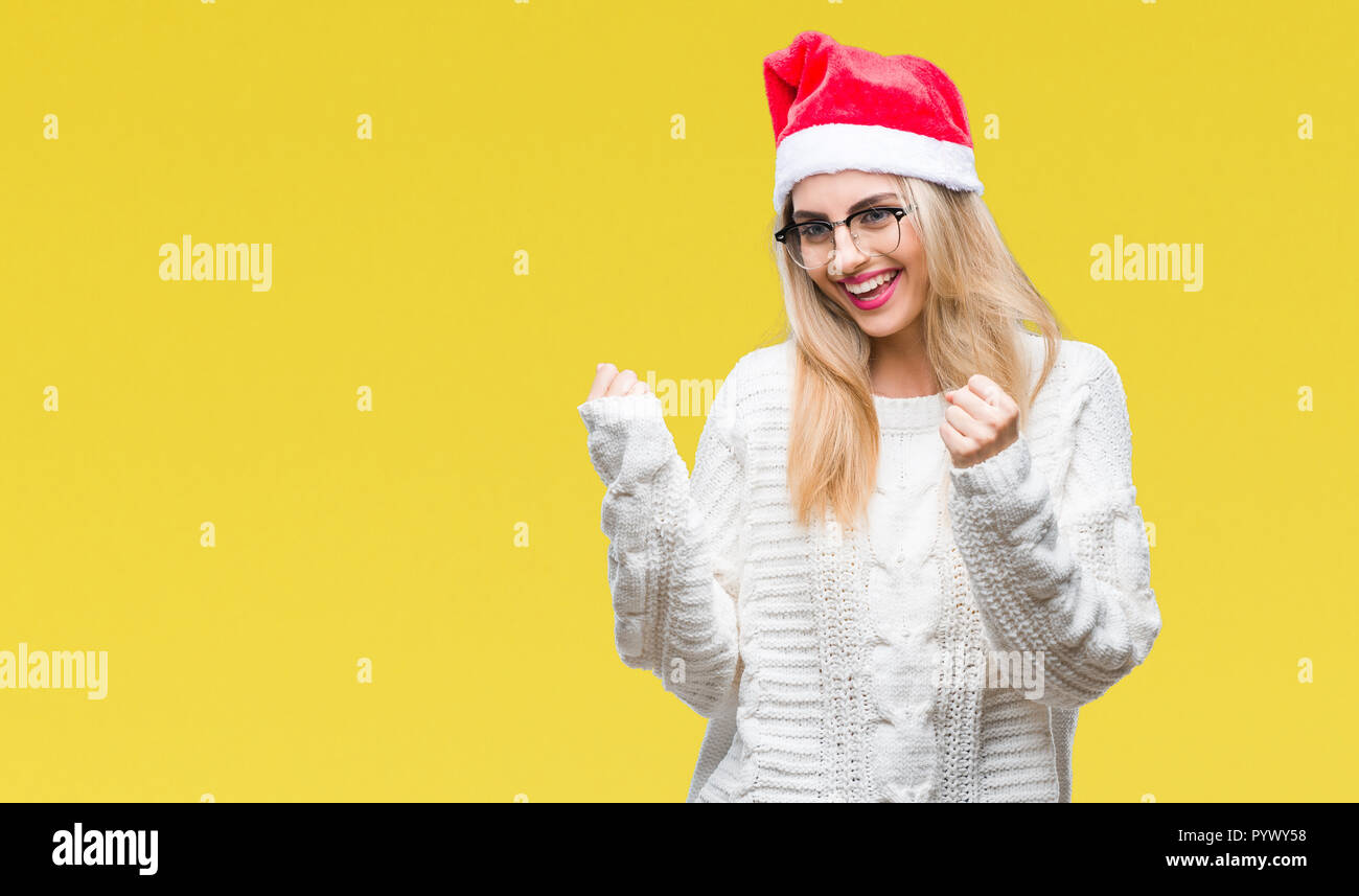 Young Beautiful Blonde Woman Wearing Christmas Hat Over Isolated
