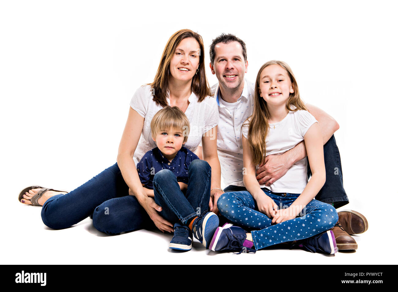 A Happy family with two kids on studio white background Stock Photo - Alamy