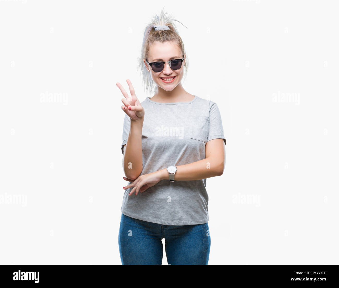 Young blonde woman wearing sunglasses over isolated background smiling ...