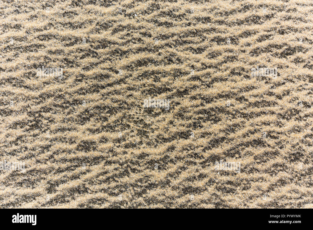 Tropical beach dark sand texture background Stock Photo - Alamy