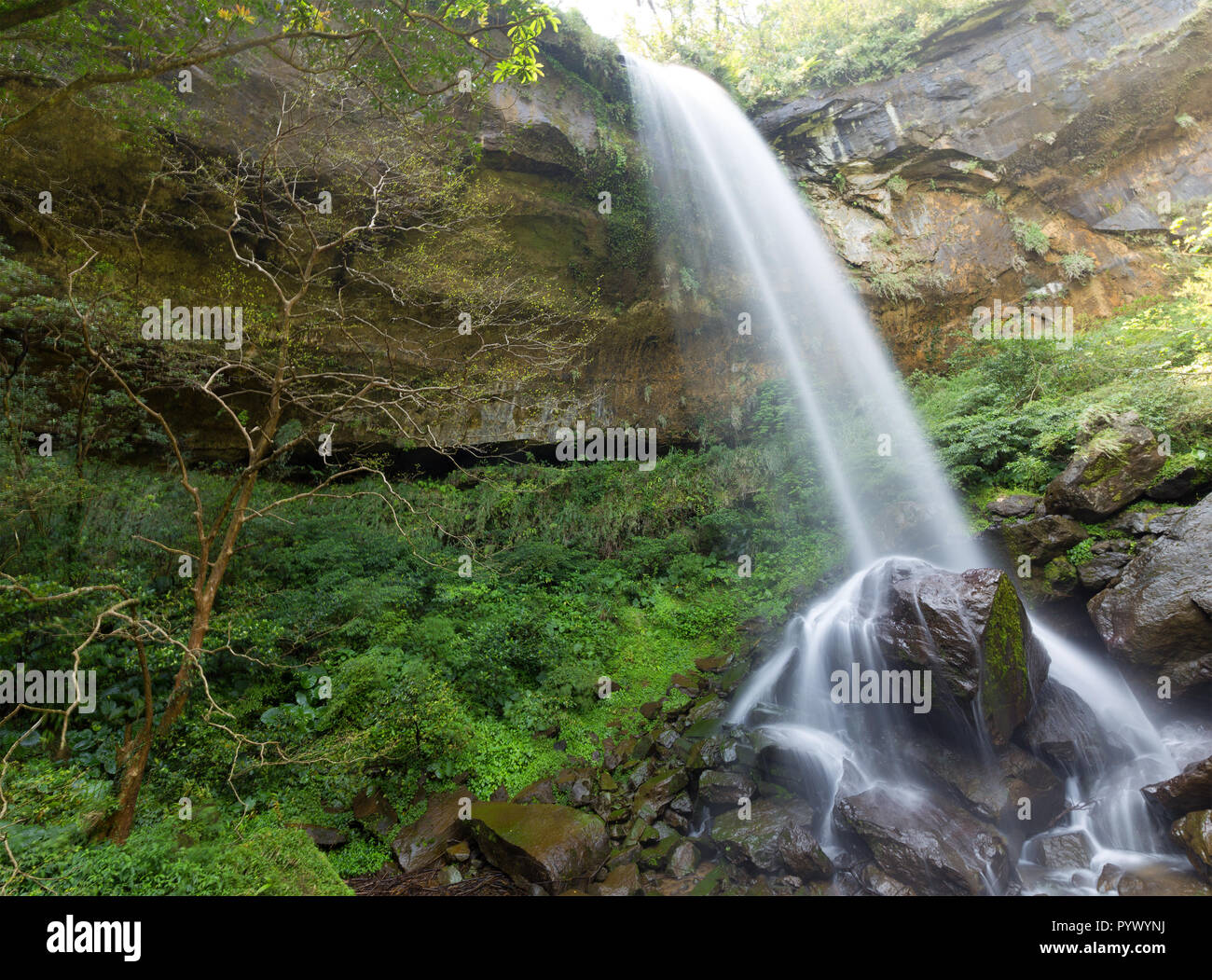 The Motian waterfall flowing on big rocks in the Sandiaoling park ...