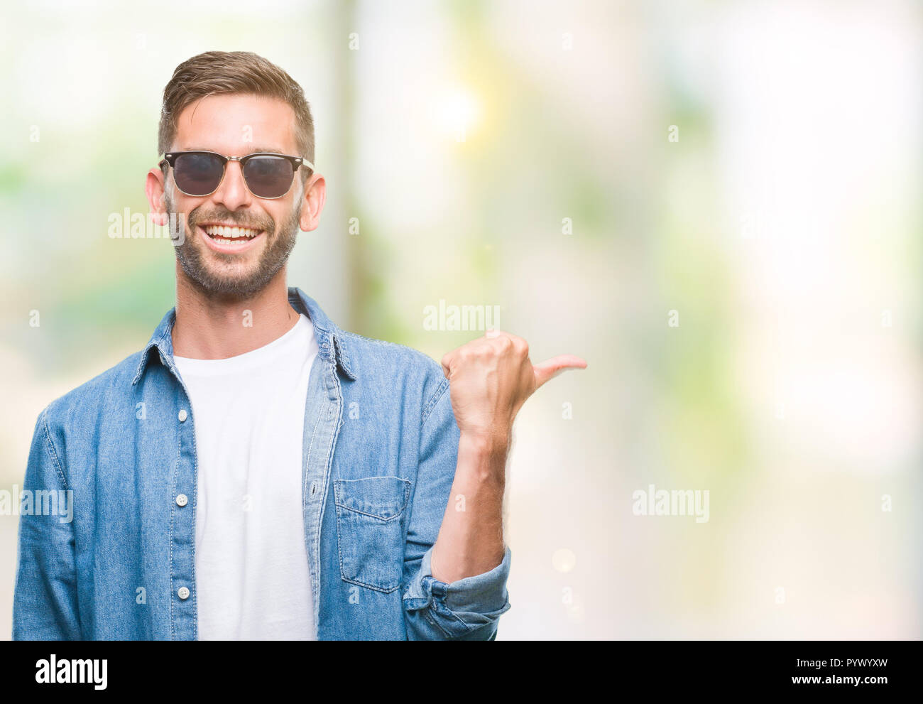 Young handsome man wearing sunglasses over isolated background smiling ...