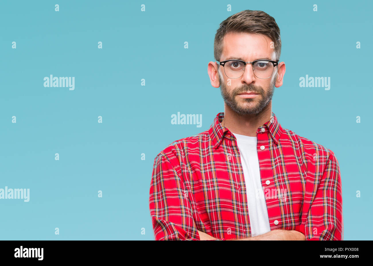 Young handsome man over isolated background skeptic and nervous ...