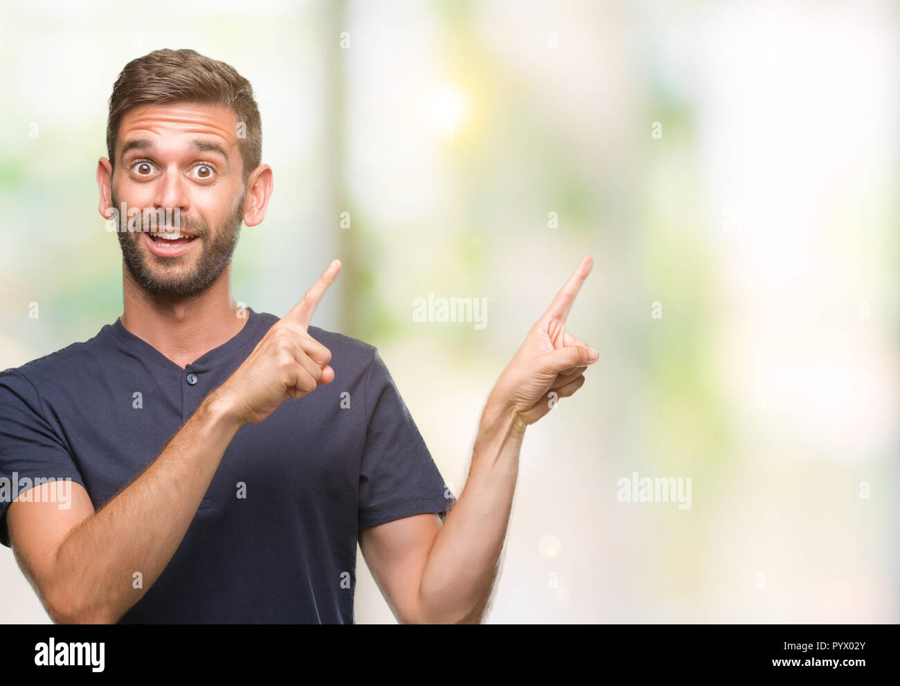 Young handsome man over isolated background smiling and looking at the ...