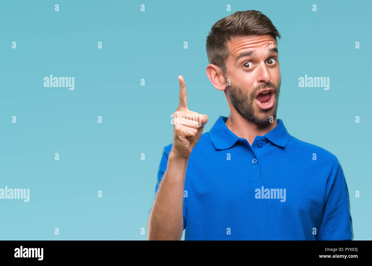 Young handsome man over isolated background pointing finger up with ...