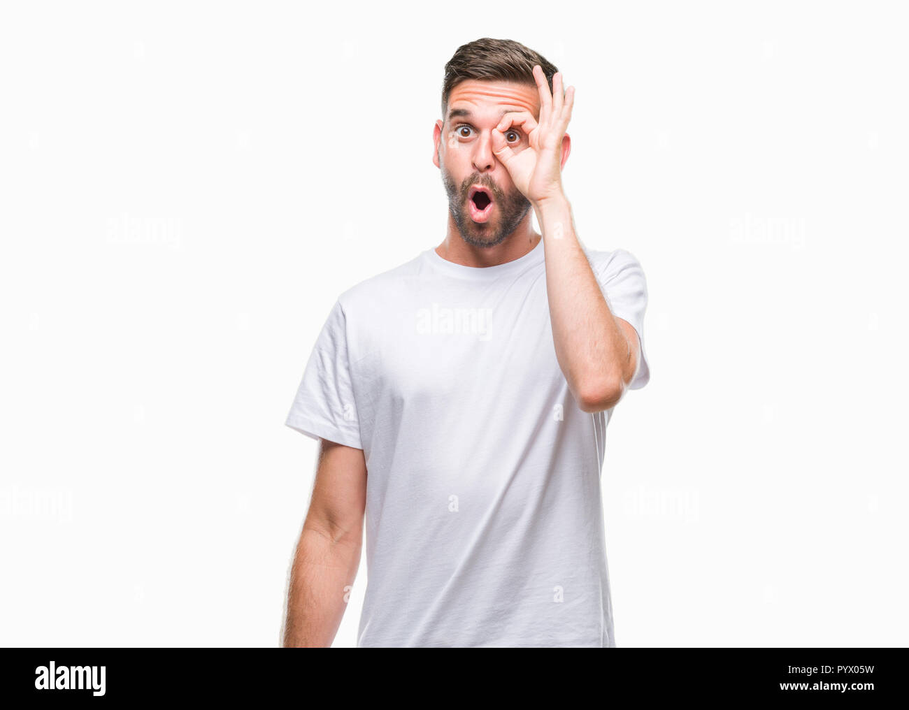 Young handsome man over isolated background doing ok gesture shocked ...