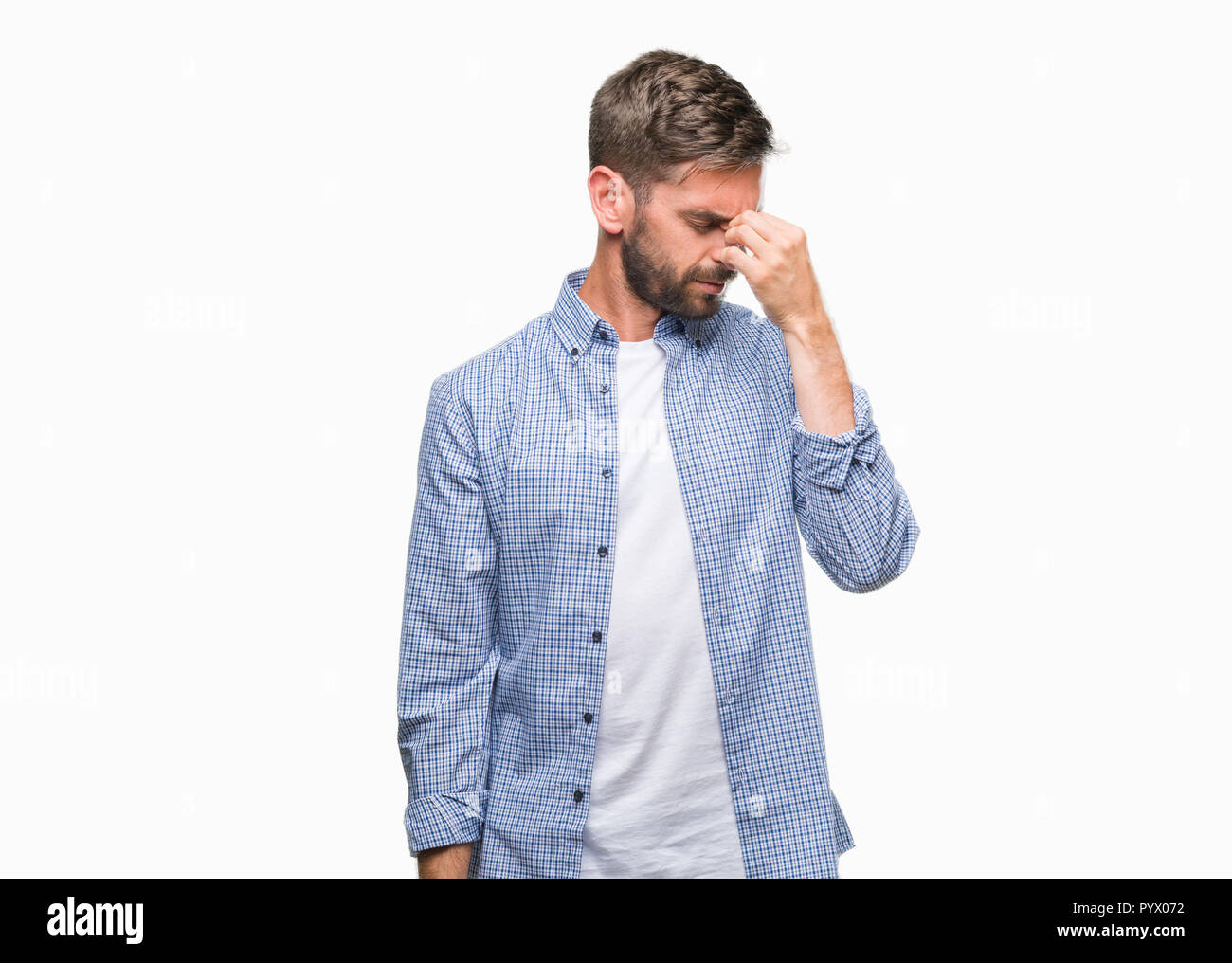 Young handsome man wearing white t-shirt over isolated background tired ...