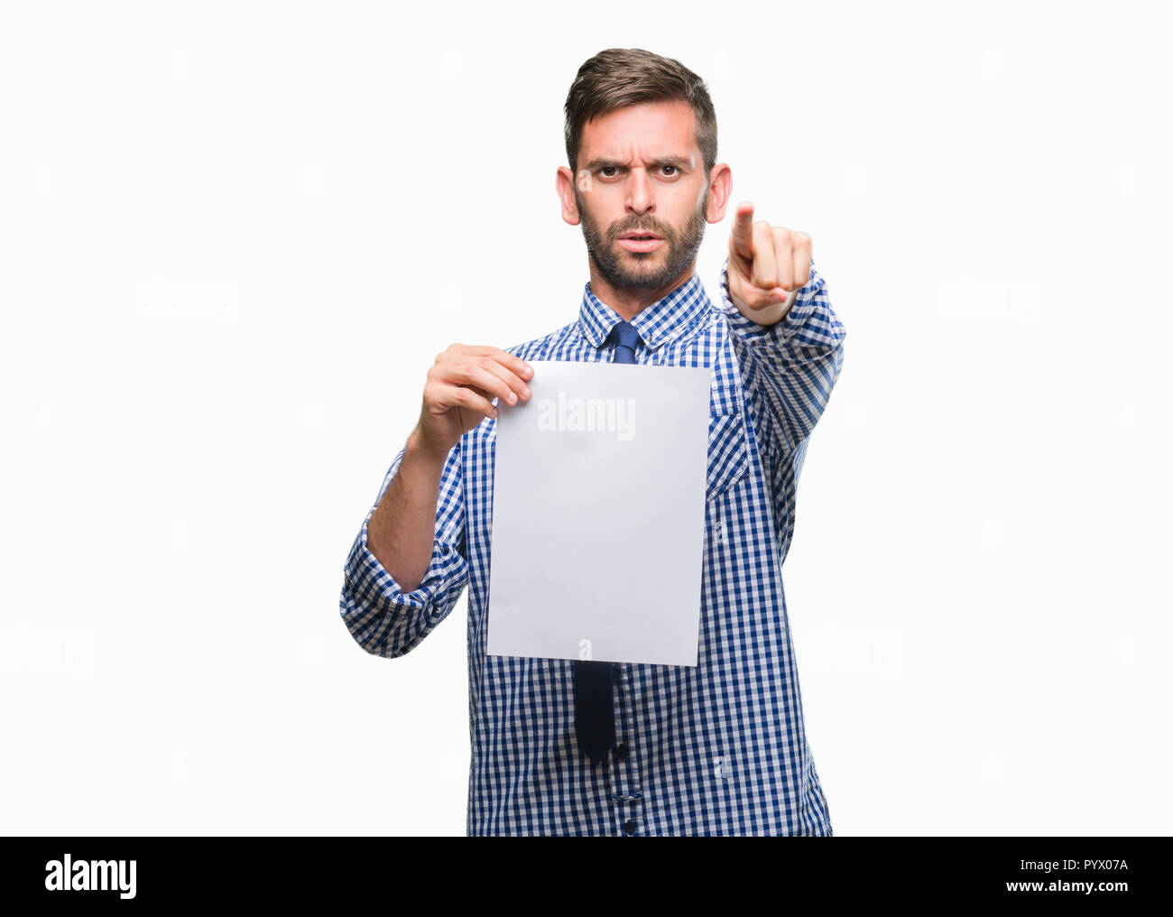 Young handsome man holding blank paper over isolated background ...
