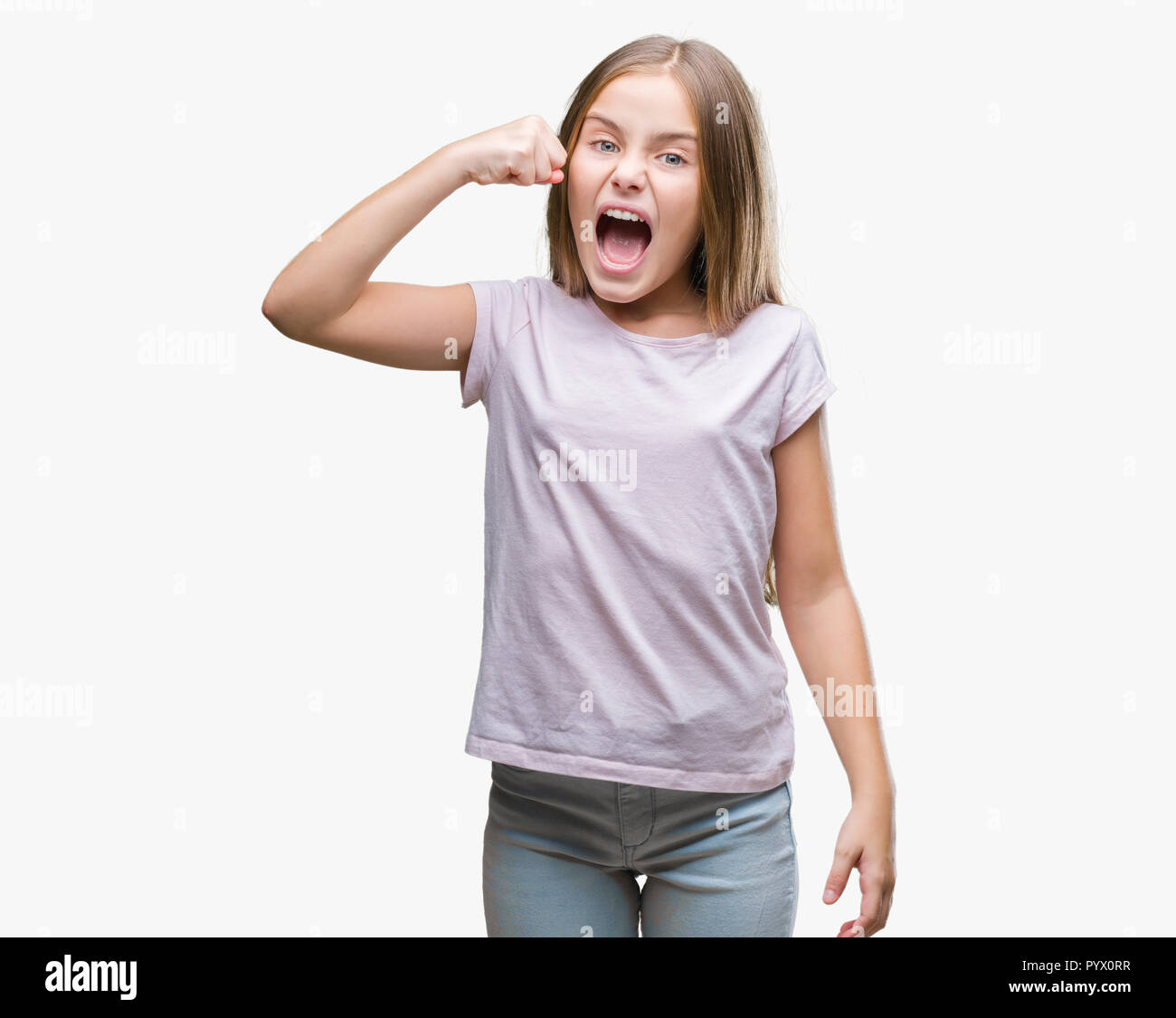 Young beautiful girl over isolated background angry and mad raising ...