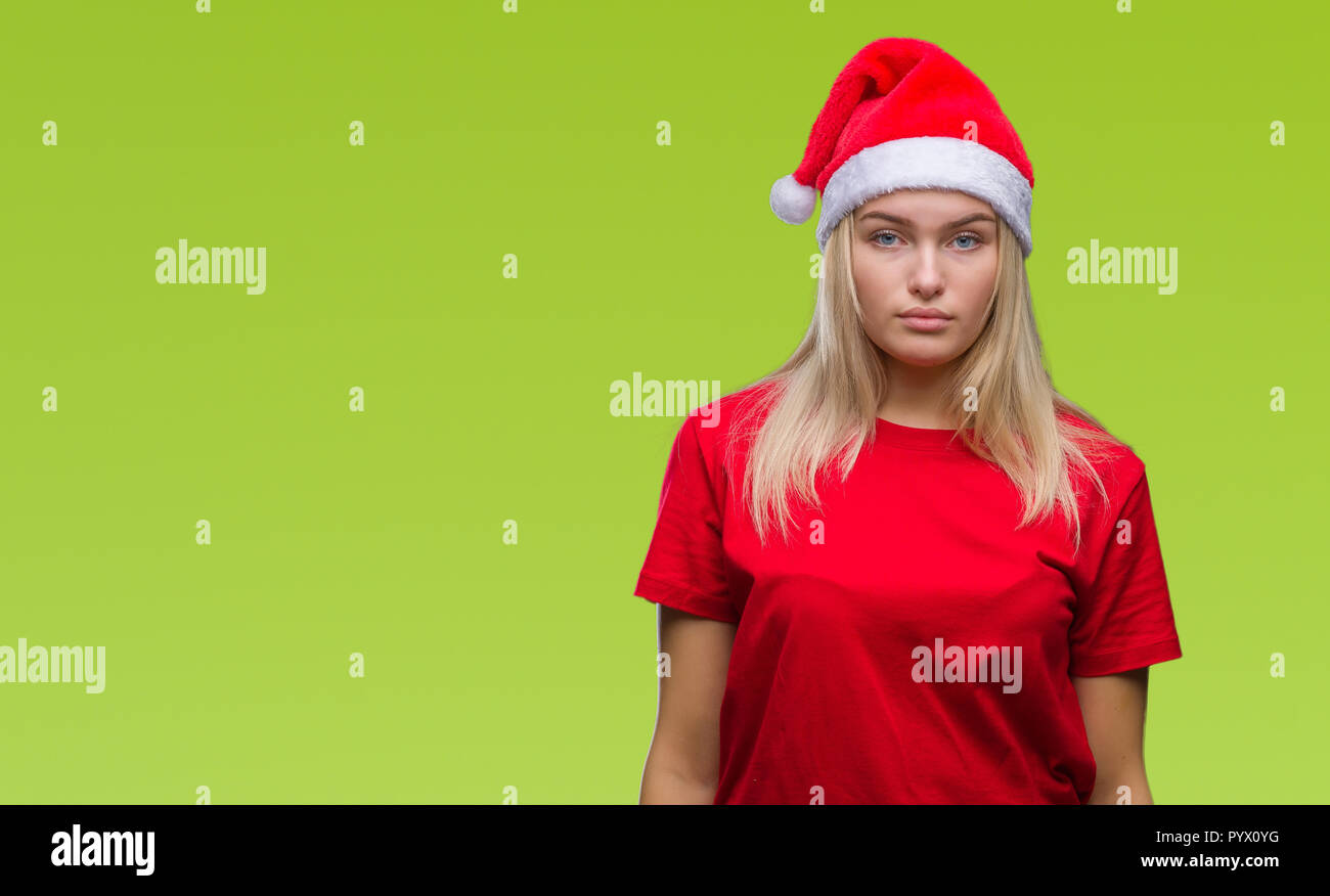 Young caucasian woman wearing christmas hat over isolated background ...