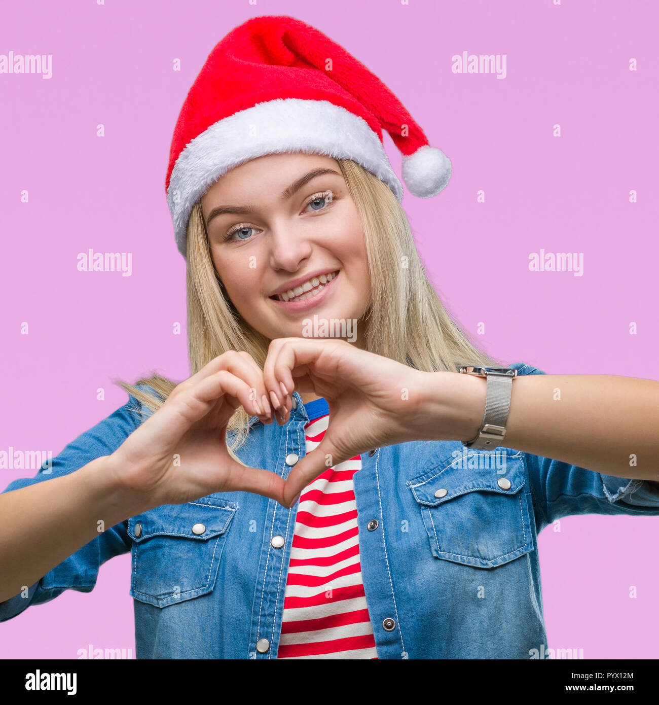 Young caucasian woman wearing christmas hat over isolated background ...