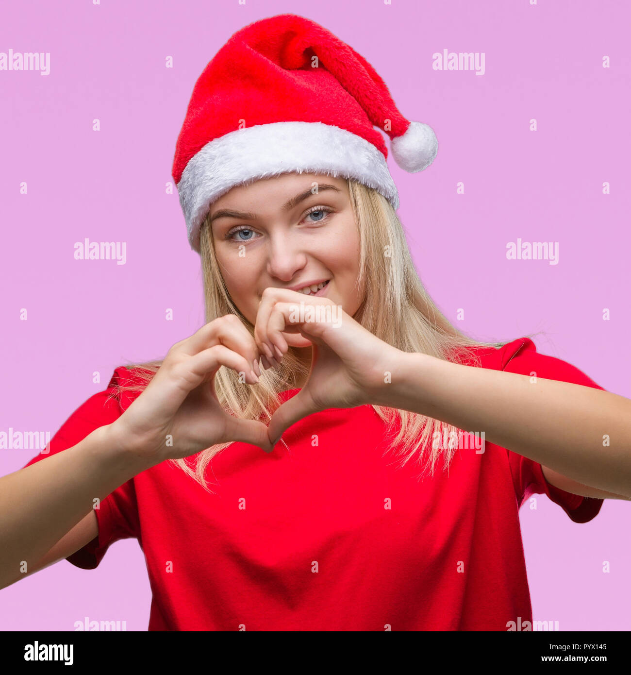 Young Caucasian Woman Wearing Christmas Hat Over Isolated Background