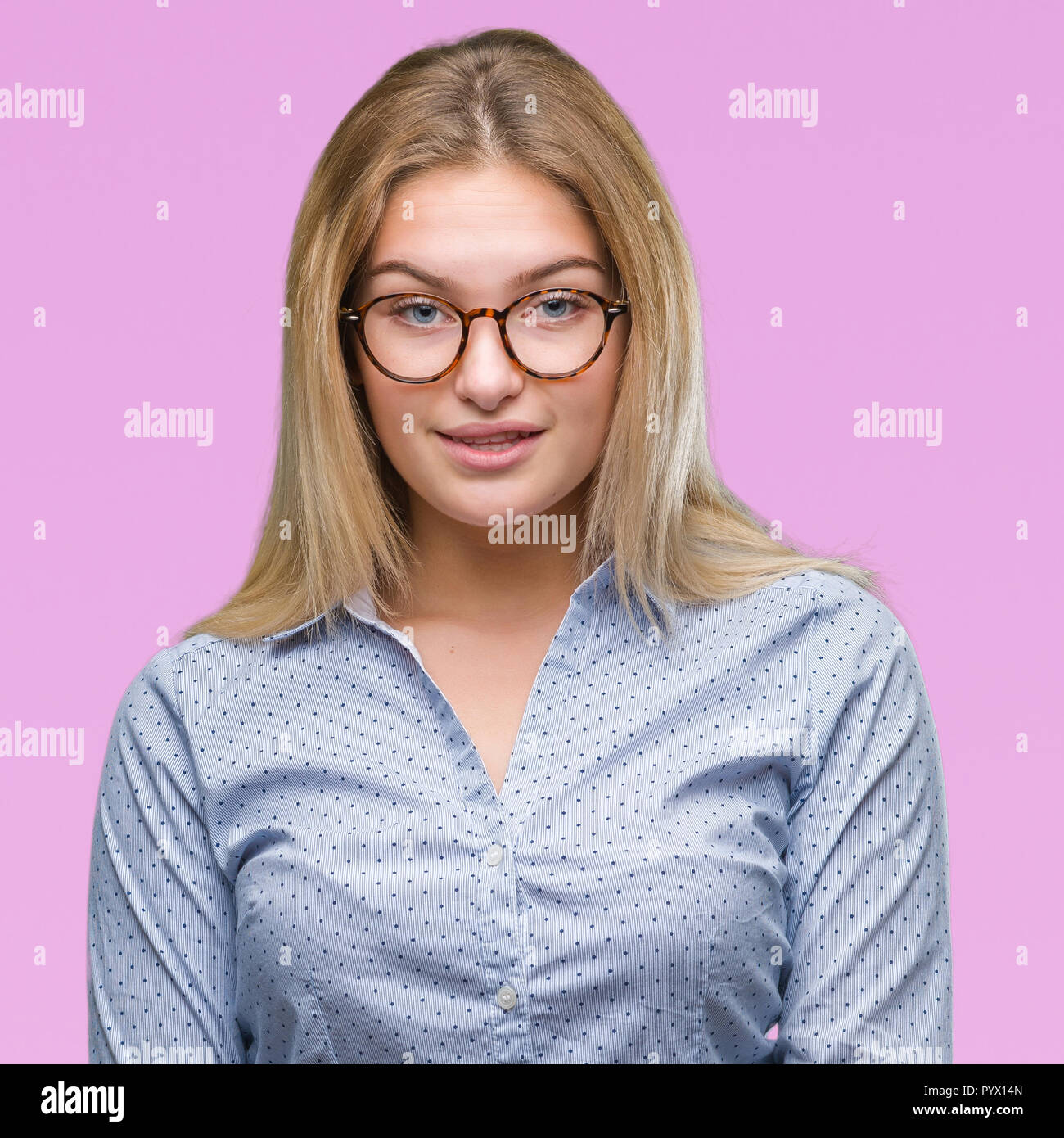 Young caucasian business woman wearing glasses over isolated background ...