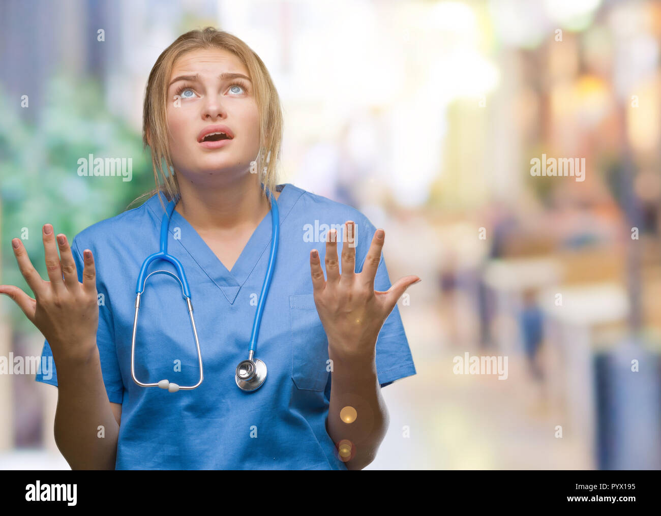 Young caucasian doctor woman wearing surgeon uniform over isolated ...