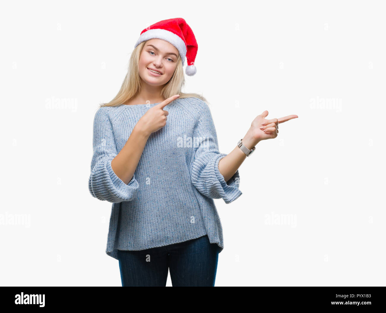 Young caucasian woman wearing christmas hat over isolated background ...