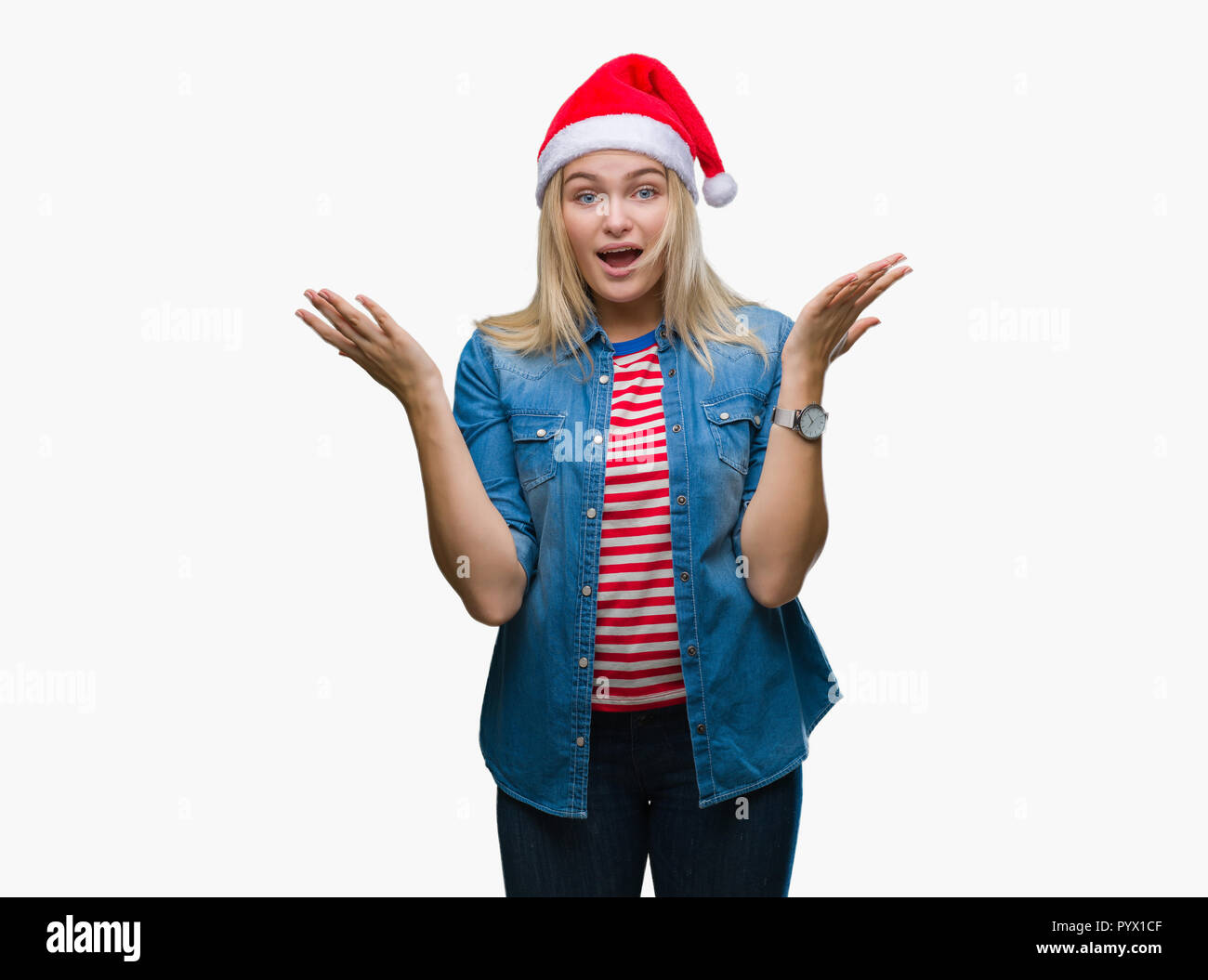 Young caucasian woman wearing christmas hat over isolated background ...