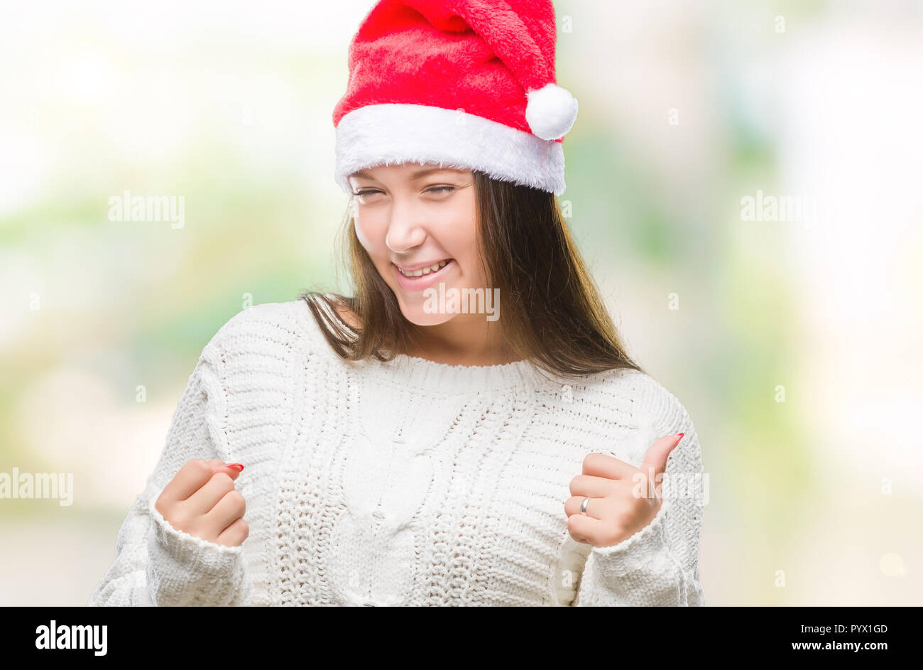Young beautiful caucasian woman wearing christmas hat over isolated ...
