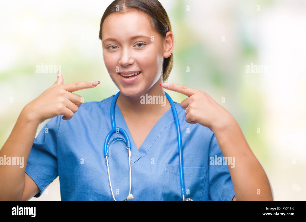 Young caucasian doctor woman wearing medical uniform over isolated ...
