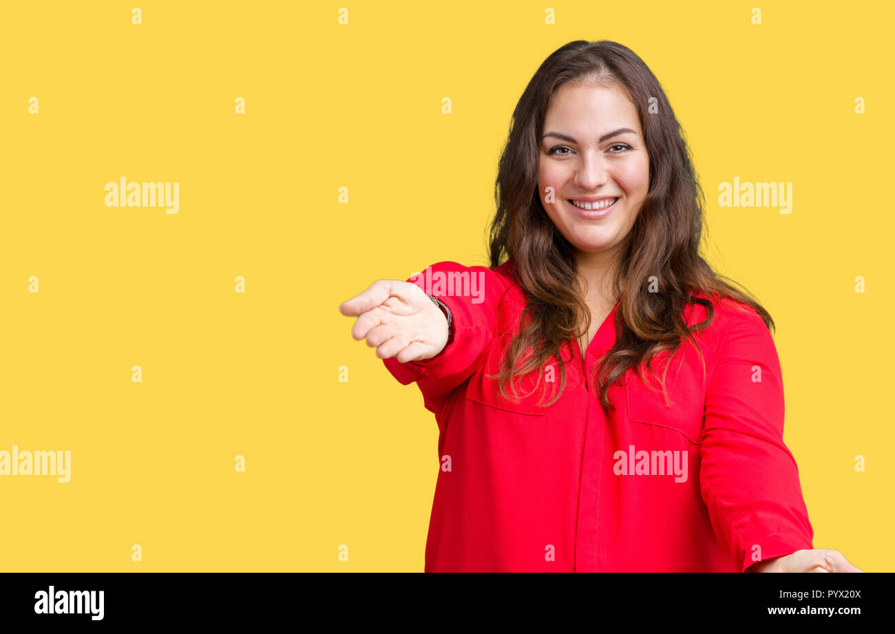 Beautiful plus size young business woman over isolated background ...