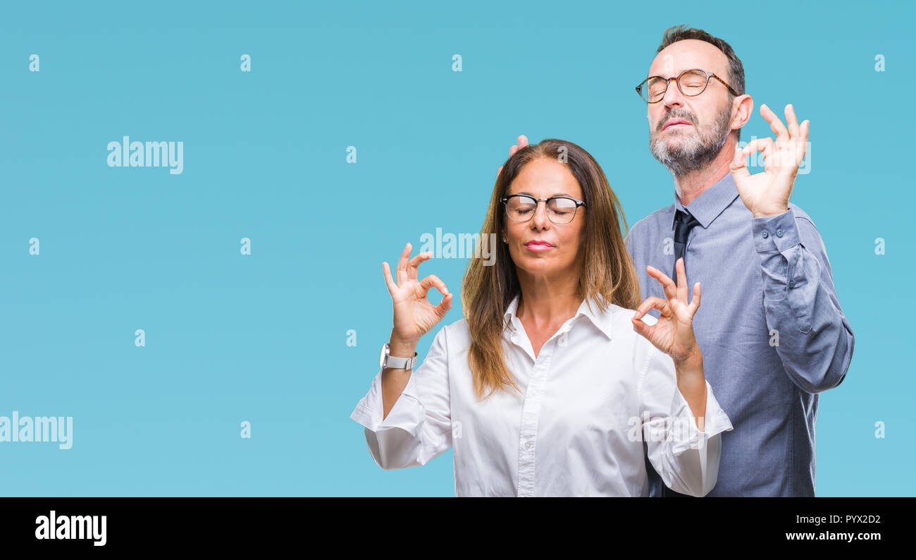 Middle age hispanic couple in love wearing glasses over isolated ...