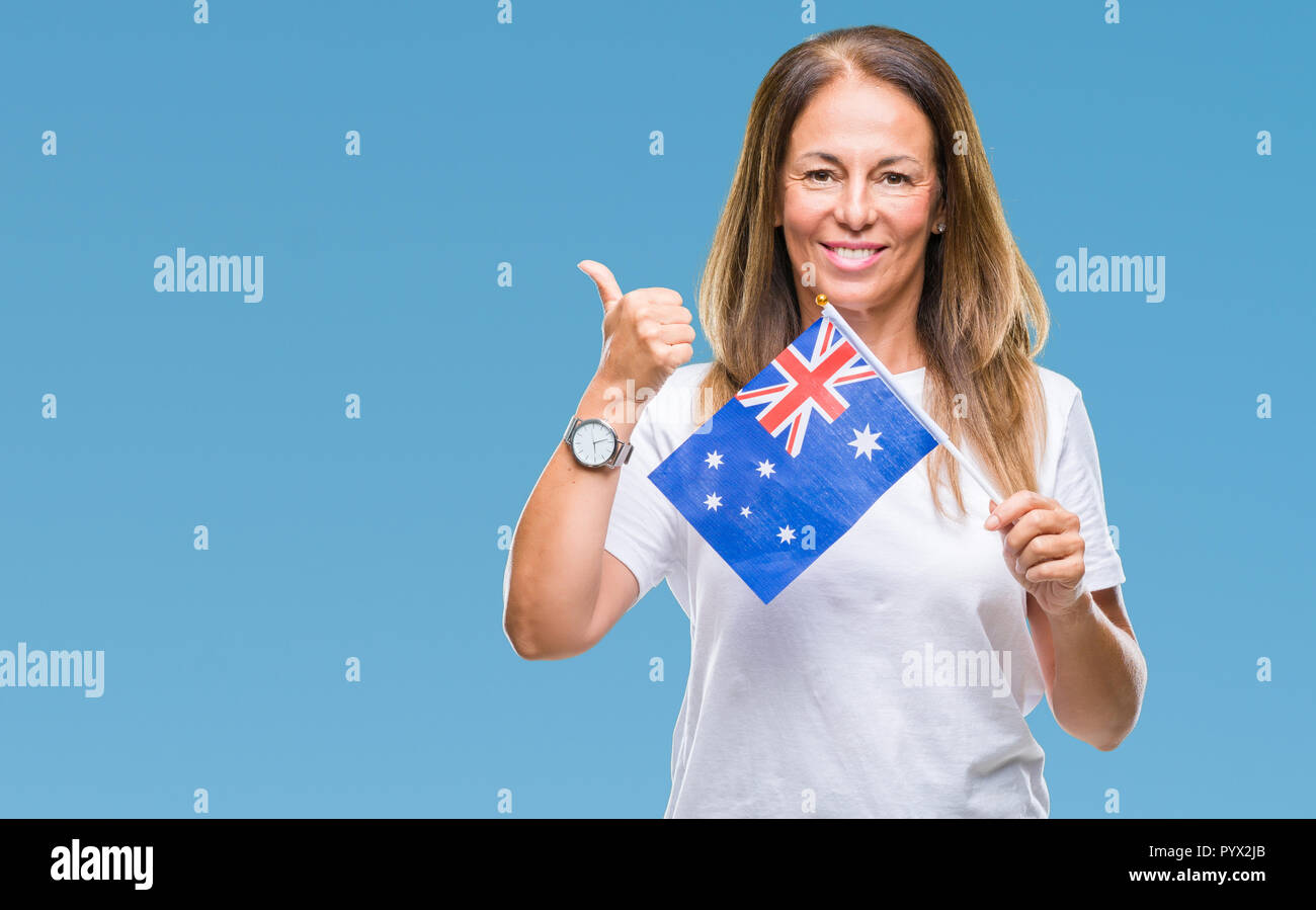 Middle age hispanic woman holding flag of Australia over isolated ...