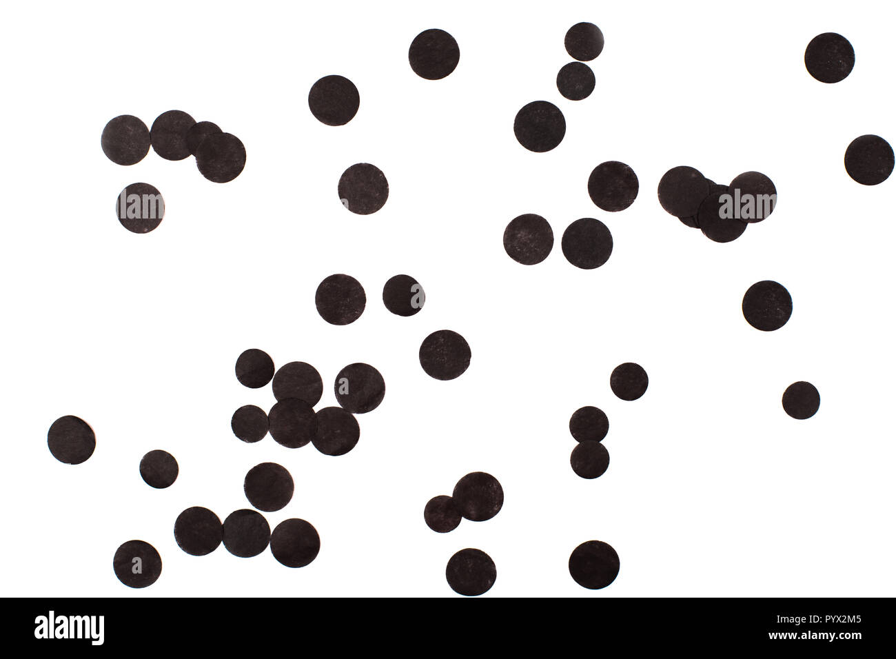 Black circles cut out on white background. Festive concept. Flat lay ...